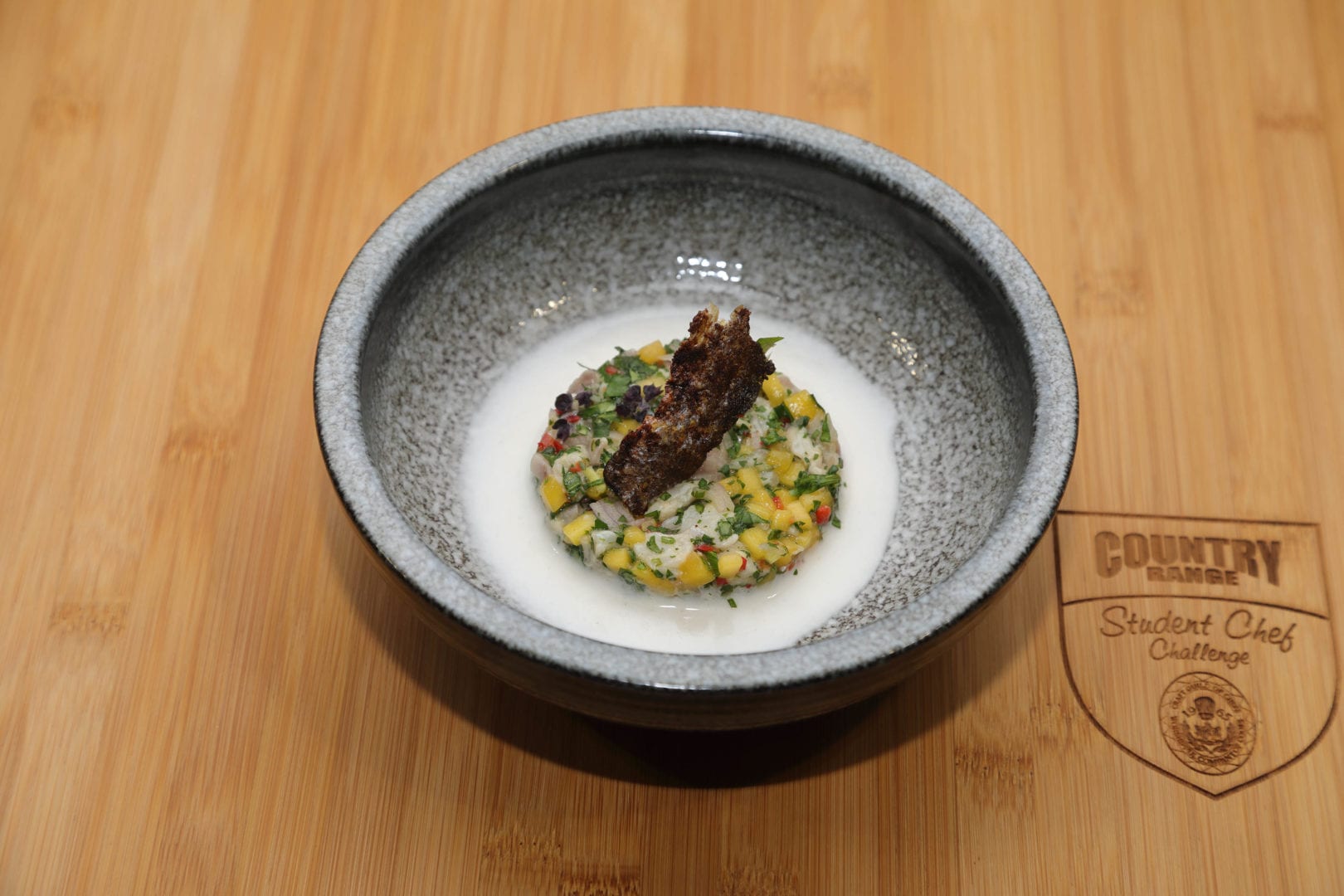 Asian cured sea bass with a coconut fumet and shards of crispy skin ...